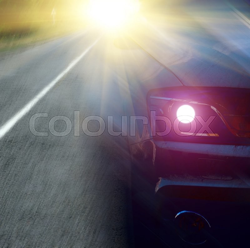 Car on the road with morning sun | Stock image | Colourbox