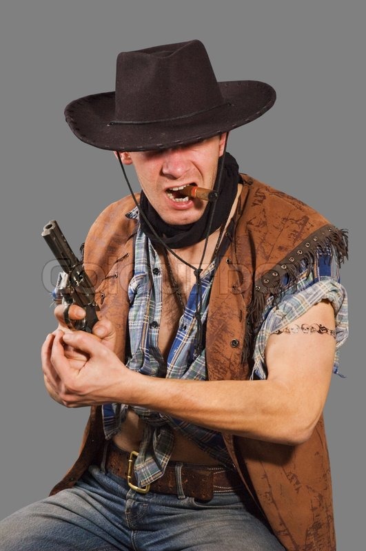 Cowboy mit Revolver auf grauem ... | Stock Bild | Colourbox
