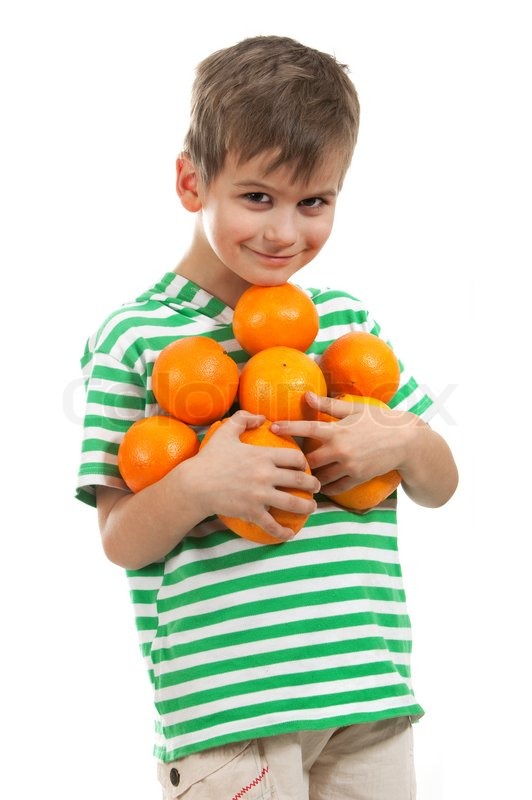 Boy holding oranges isolated on white ... | Stock image | Colourbox
