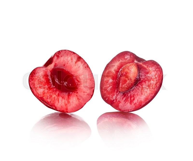 The two halves of juicy cherries on an ... | Stock image | Colourbox