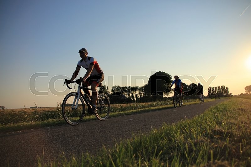 The cyclers biking in a group at the ... | Stock image | Colourbox