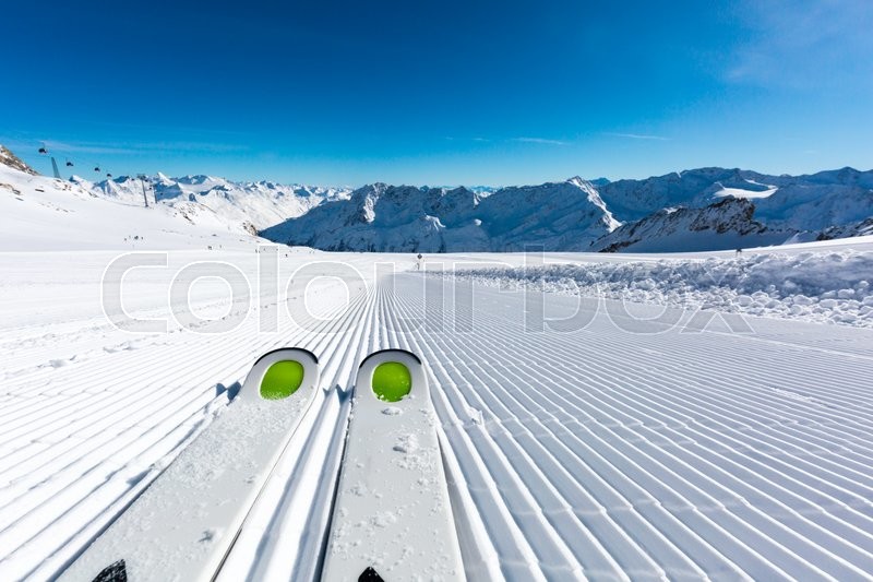 Pair of ski tips standing on the fresh ... | Stock image | Colourbox