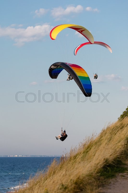 Multiple paragliders with their ... | Stock image | Colourbox
