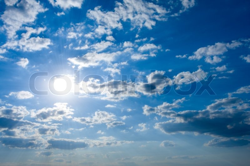 Cloudscape med solen i blå himmel | Stock foto | Colourbox