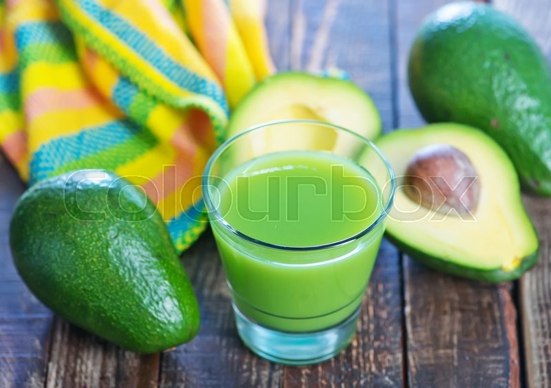 Avocado drink in glass and on a table | Stock image | Colourbox