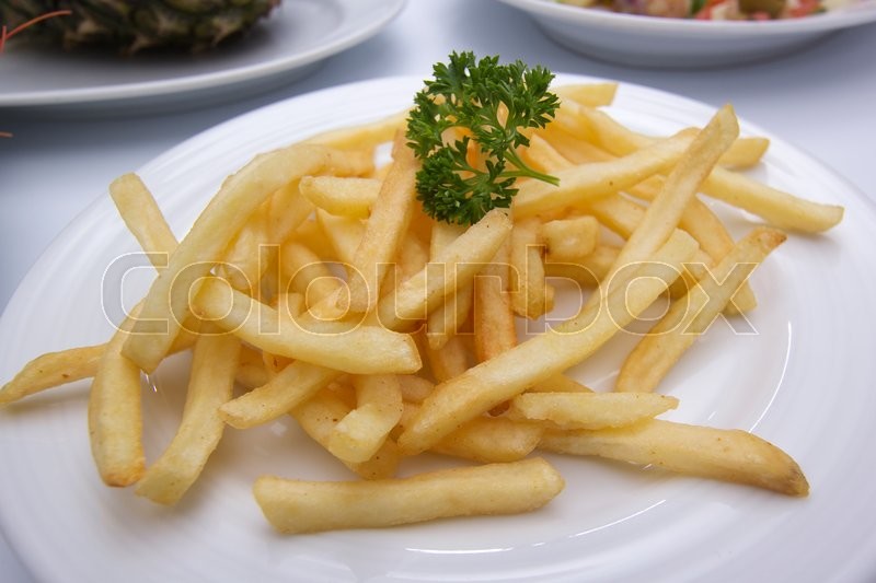 Fresh french fries in the plate | Stock image | Colourbox