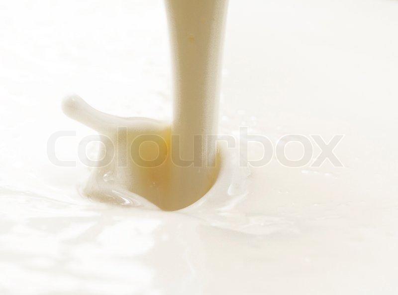 Pouring yogurt and splash | Stock Photo | Colourbox