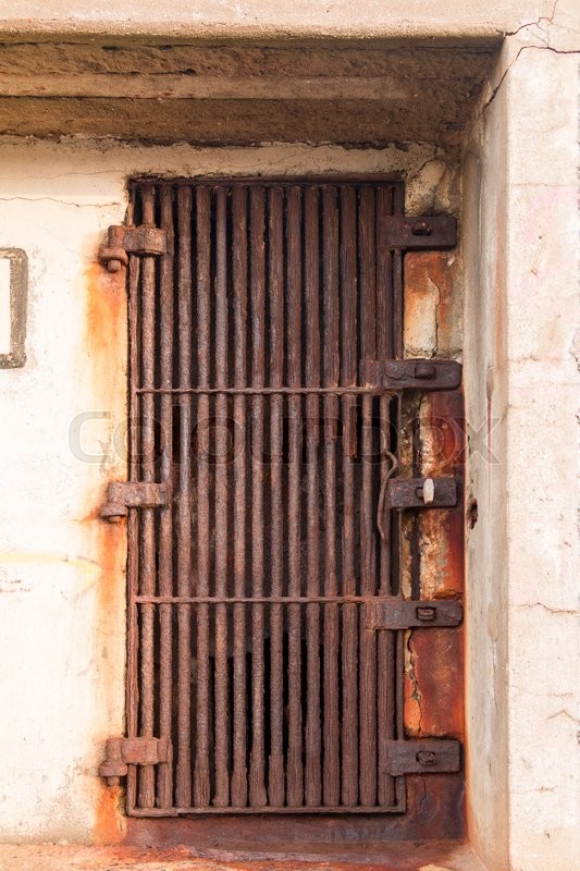 Old rusty door in the form of a thick ... | Stock image | Colourbox