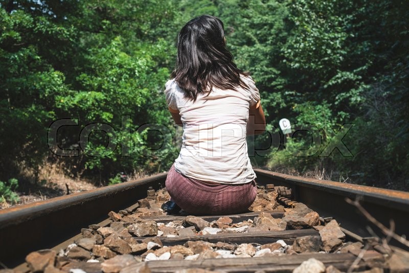 Women sitting on railroad | Stock image | Colourbox
