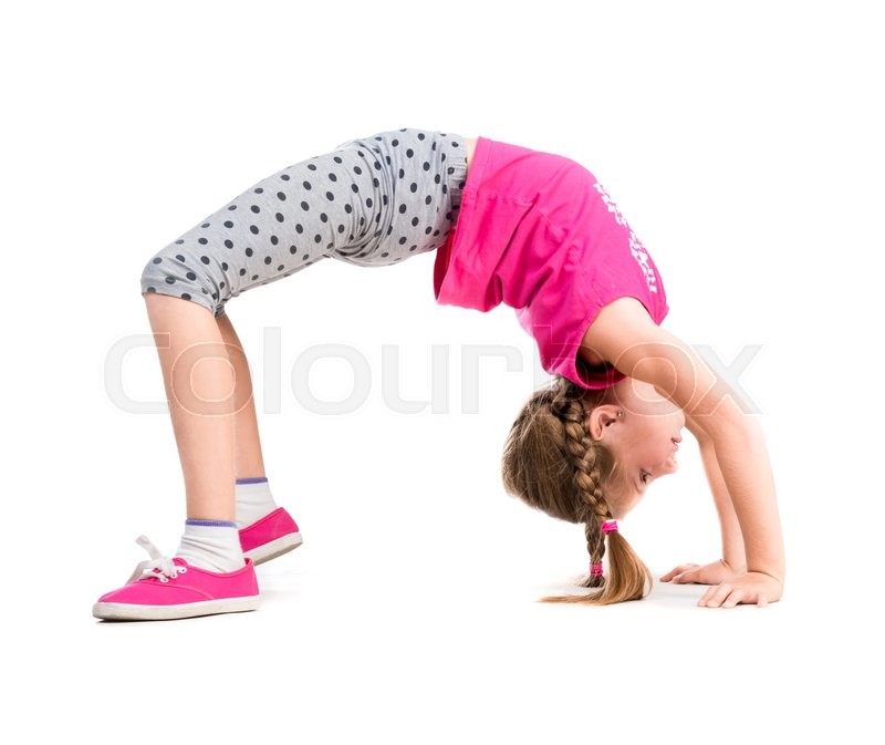Little girl doing the bridge exercise ... | Stock image | Colourbox