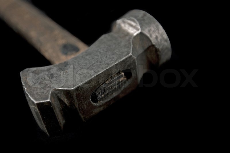 Vintage shoemaker hammer over black ... | Stock image | Colourbox
