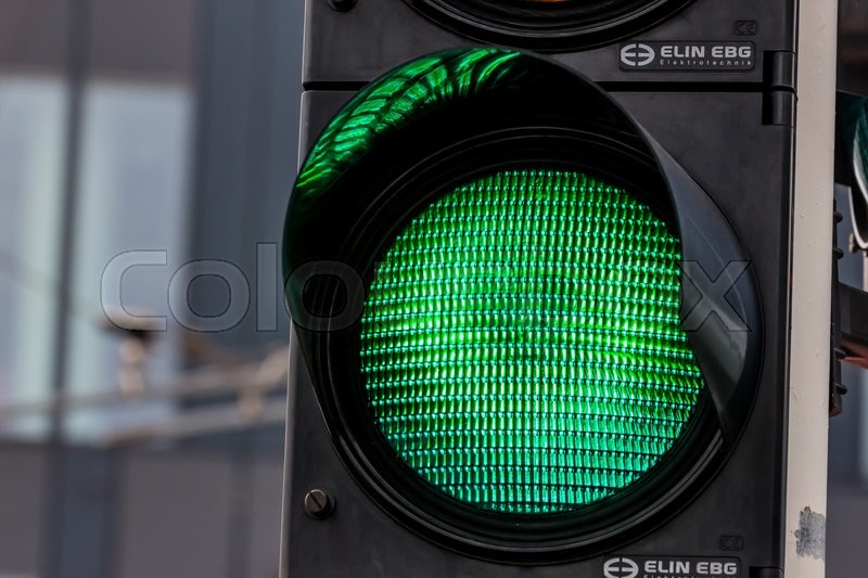 A traffic light shows green light for ... | Stock image | Colourbox
