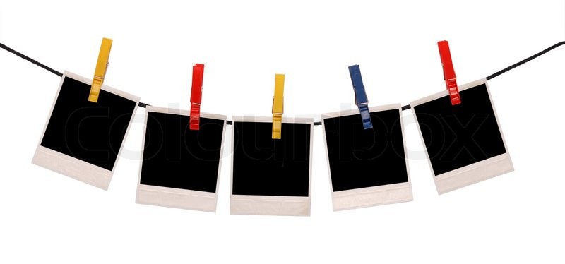 Photo frames on a rope isolated on ... | Stock image | Colourbox