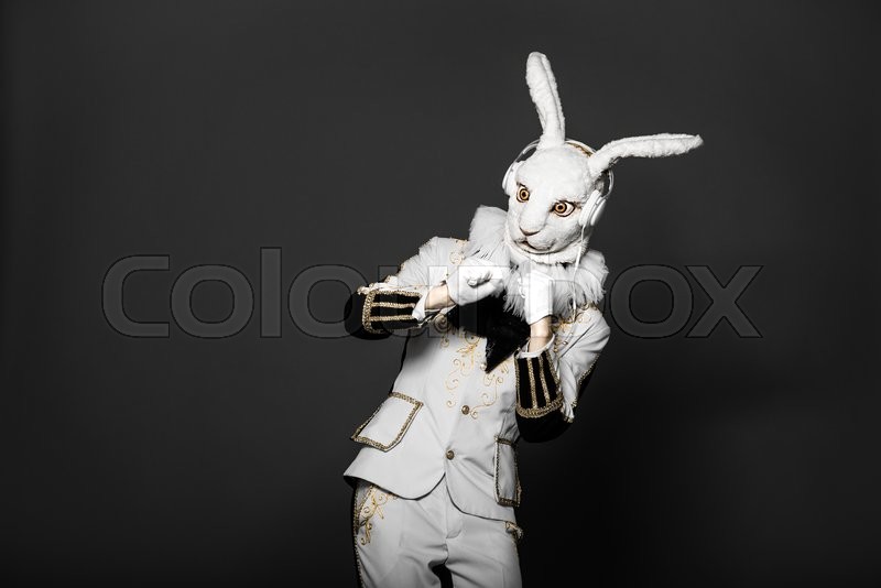 Actor posing in white rabbit suit with ... | Stock image | Colourbox