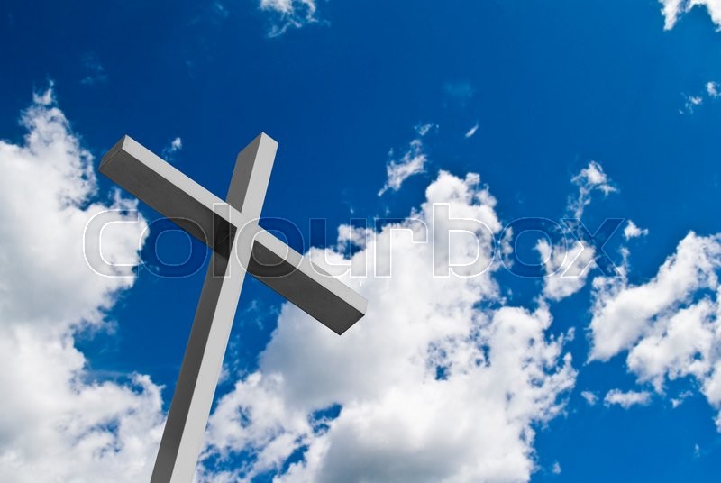 Cross with sunny blue sky and cloud | Stock image | Colourbox