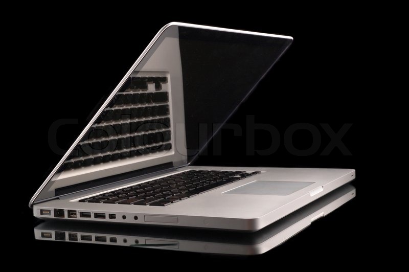 Aluminium laptop with desktop on black ... | Stock image | Colourbox