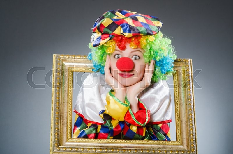 Clown with picture frame in funny ... | Stock Photo | Colourbox