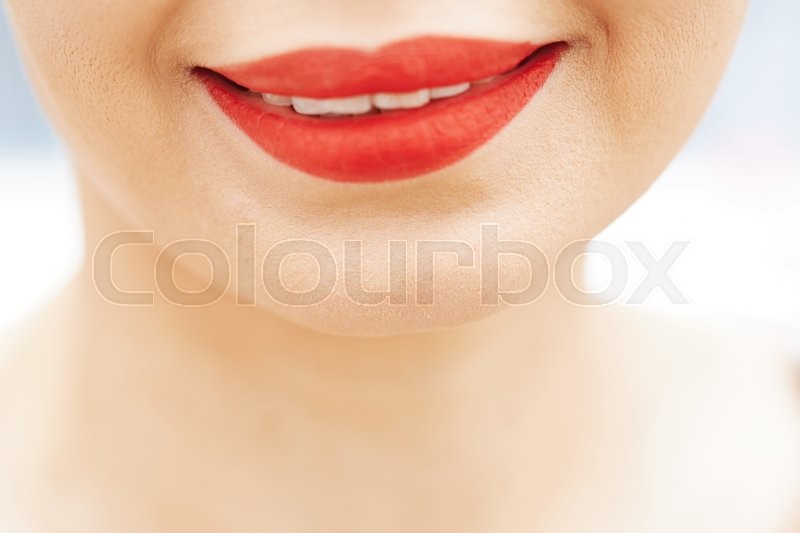 Smiling woman with red lips. Close-up ... | Stock image | Colourbox