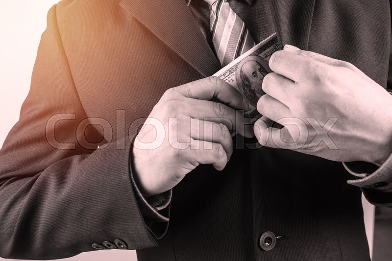 Businessman hand gripping money, US ... | Stock image | Colourbox