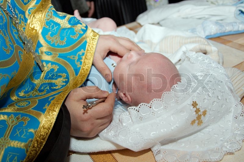 Ceremony einer Taufe in der christlichen ... | Stock Bild | Colourbox