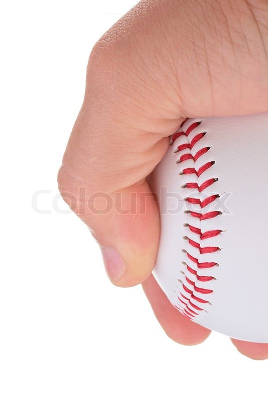 A hand holding a white baseball with ... | Stock image | Colourbox