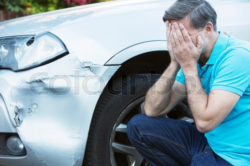 Unhappy Driver Inspecting Damage After ... | Stock image | Colourbox