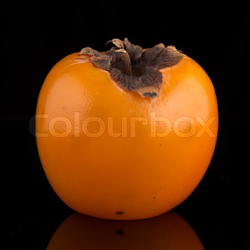 Persimmon fruit on black background. | Stock Photo | Colourbox