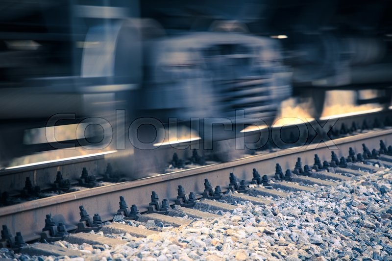 Blurred motion of spinning train wheels ... | Stock image | Colourbox