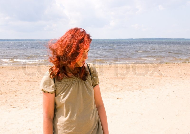 Sad woman on a beach | Stock image | Colourbox