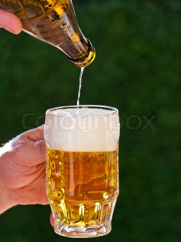 Pouring beer | Stock Photo | Colourbox
