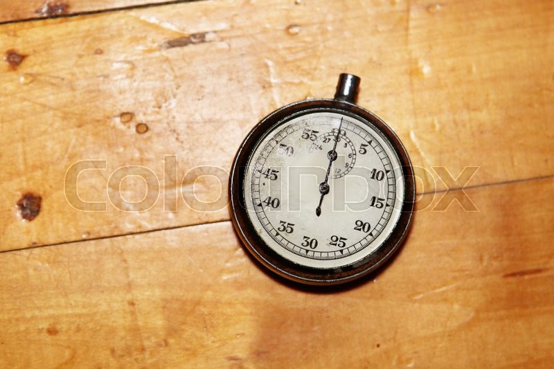 Old and vintage stopwatch over a wooden ... | Stock image | Colourbox