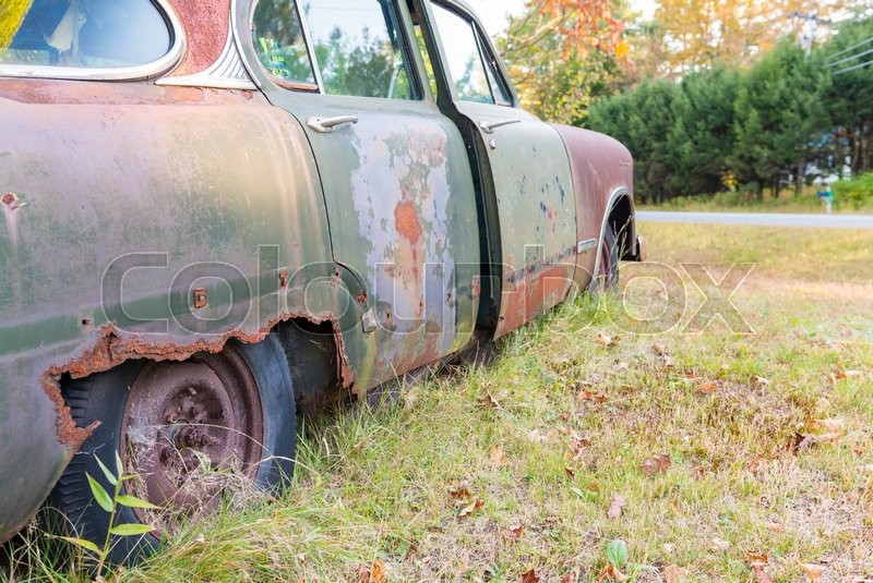 Abandoned old car decaying in the ... | Stock image | Colourbox