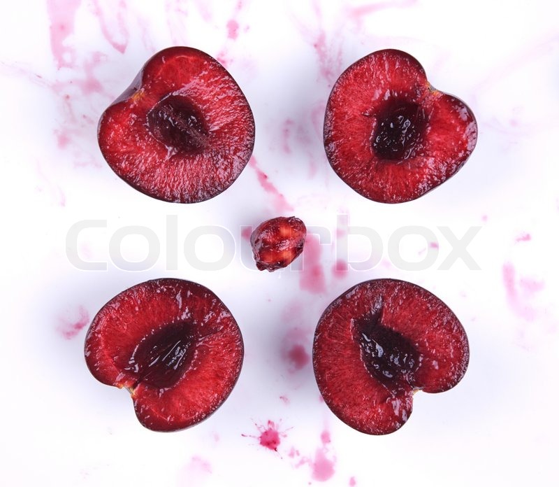 Image of fresh cherries cut in halves ... | Stock image | Colourbox