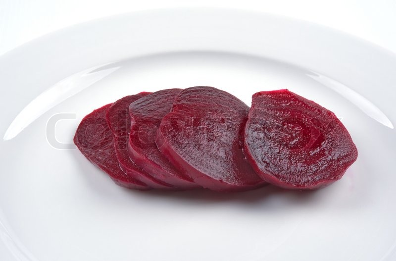 Sliced boiled beetroot on a white plate | Stock Photo | Colourbox