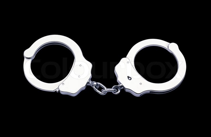 Metal handcuffs isolated on the black background | Stock Photo | Colourbox