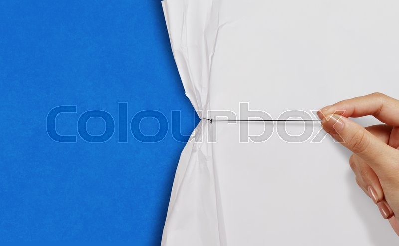Hand pull rope open wrinkled paper show ... | Stock image | Colourbox