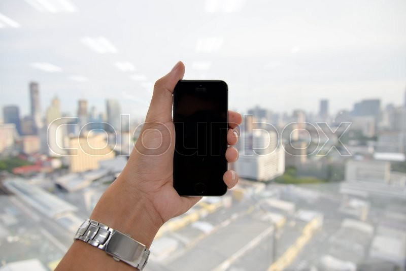 Hand hold mobile phone | Stock image | Colourbox