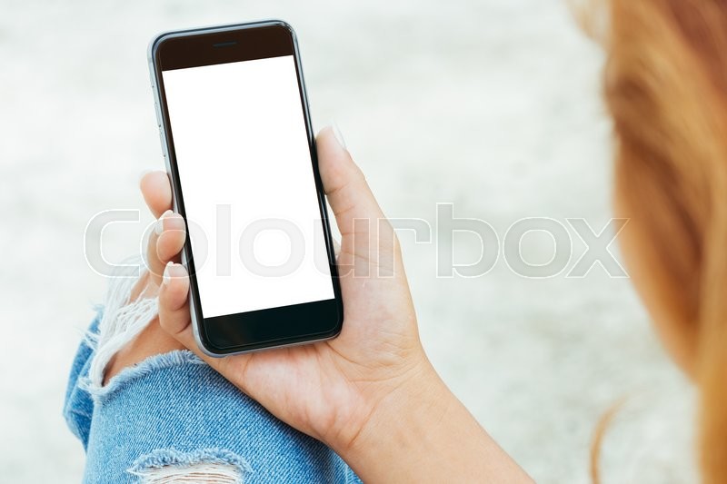 Female using phone white screen display | Stock image | Colourbox