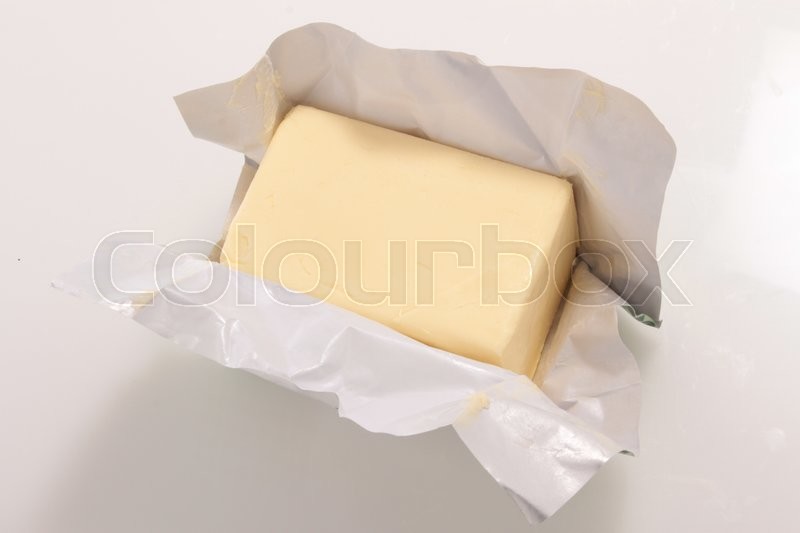Butter pat in foil wrap | Stock Photo | Colourbox