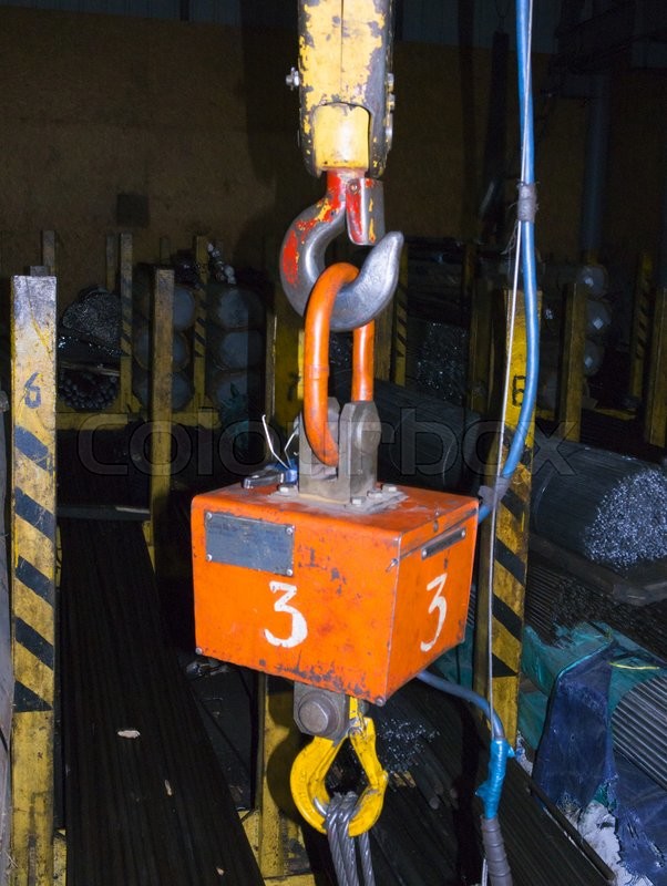 Crane hook in factory warehouse | Stock image | Colourbox
