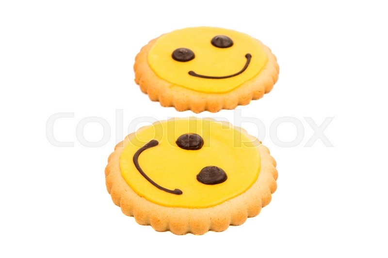 Yellow Smiley biscuit on a white ... | Stock image | Colourbox