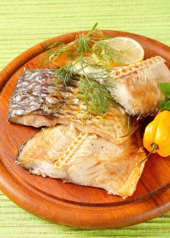 Oven-baked carp fillets on round ... | Stock image | Colourbox