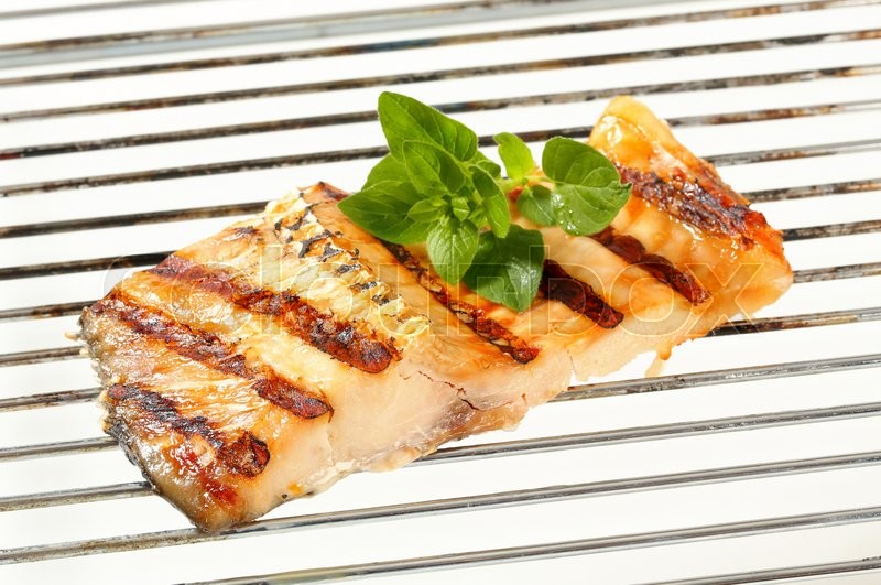 Grilled carp fillet on a grid | Stock image | Colourbox