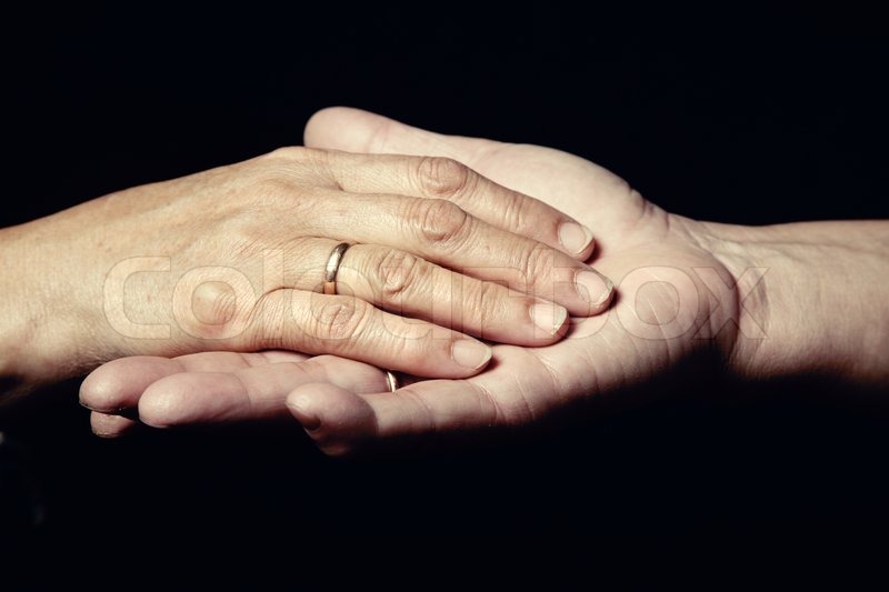 Two hands of senior people with ... | Stock image | Colourbox