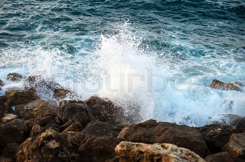 Big windy waves splashing over rocks. ... | Stock image | Colourbox