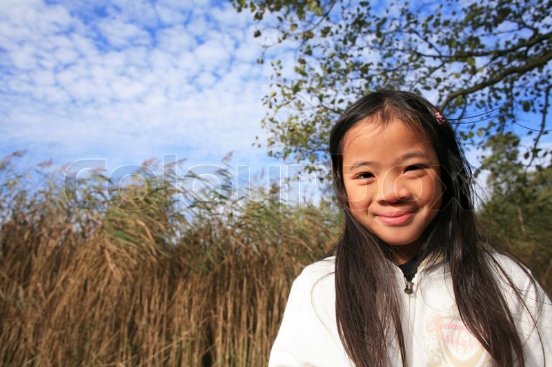 Cute chinese child portrait outdoor in ... | Stock image | Colourbox