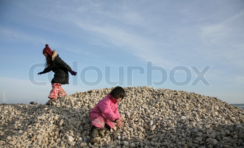 Child on stones stack in denmark on ... | Stock image | Colourbox