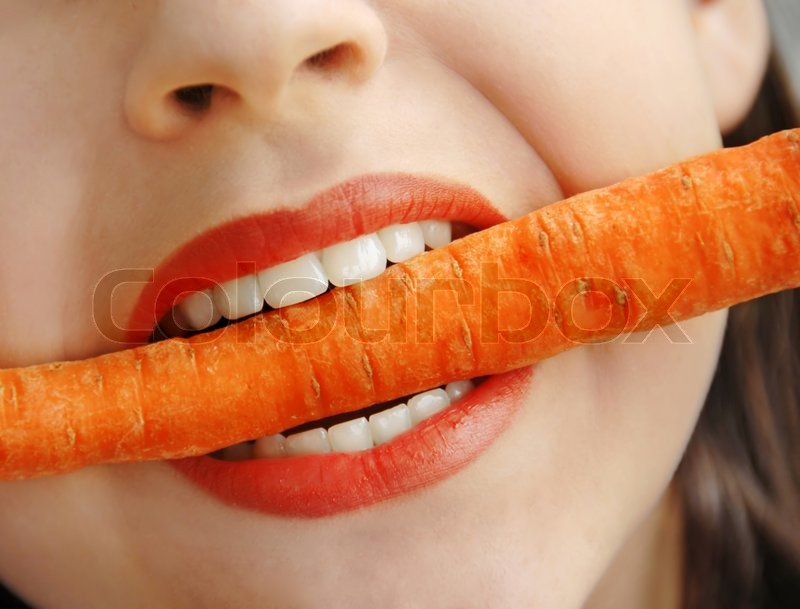 Carrot in teeth | Stock image | Colourbox