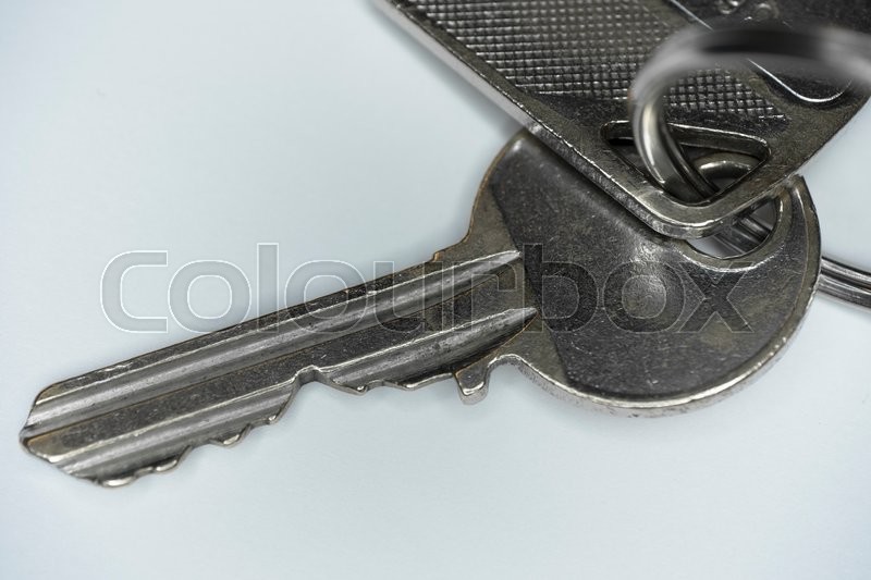 Silver keys on a light background close-up | Stock Photo | Colourbox