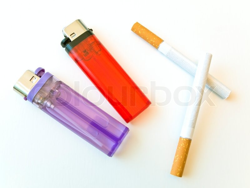 Two lighters and cigarettes at the ... | Stock image | Colourbox